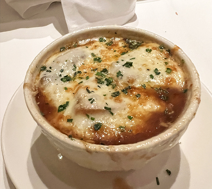 Bubbling cheese, rich broth, and a depth of flavor that could make a Frenchman weep. Comfort food with a PhD.