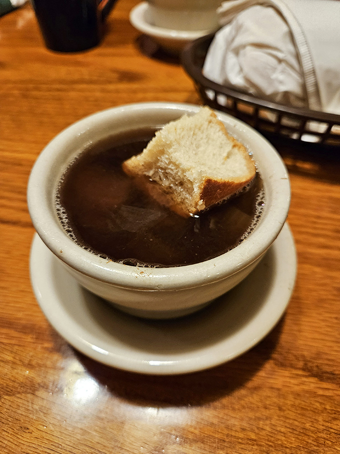 French onion soup with bread that's gone for a delicious swim. The perfect starter for a chilly Indiana evening.