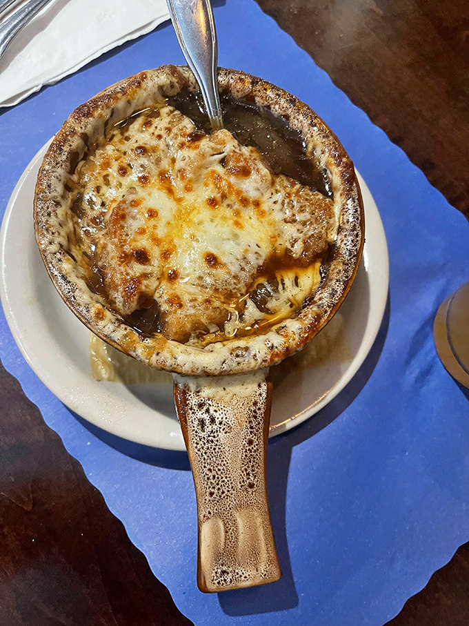 French onion soup with a cheese pull that could win Olympic medals. Dive beneath that golden crust and discover soup nirvana.