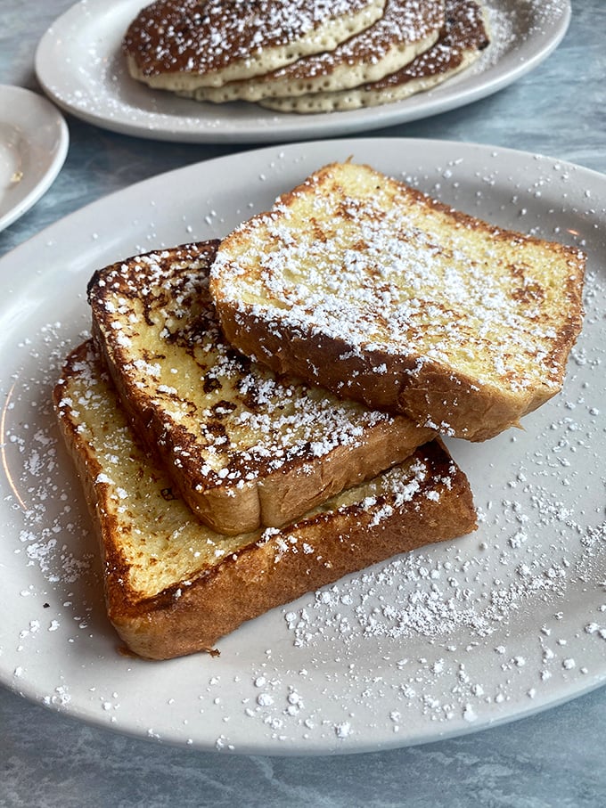 Golden-edged French toast dusted with powdered sugar&mdash;the kind that makes you wonder why anyone would ever skip breakfast. 