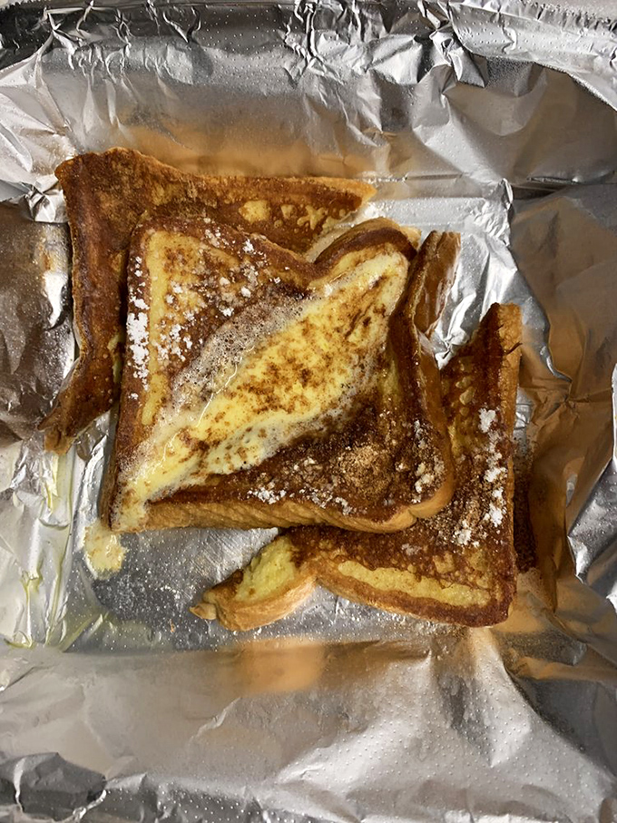 French toast that's achieved that mythical golden-brown perfection. The powdered sugar isn't just garnish&mdash;it's the fairy dust of breakfast magic.