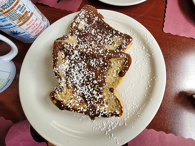 French toast that's actually French? Nope, just good old American excess&mdash;thick-cut bread transformed into a powdered sugar wonderland that would make your childhood self high-five your adult self.