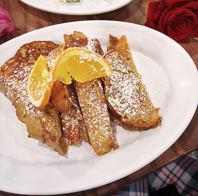 French toast that's dressed for success with powdered sugar snowfall and citrus accessories&mdash;breakfast's answer to formal wear.