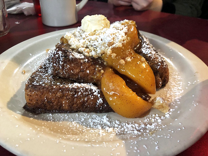 Not just French toast, but a peach-topped masterpiece that makes you wonder if dessert for breakfast was actually Georgia's best-kept secret all along.