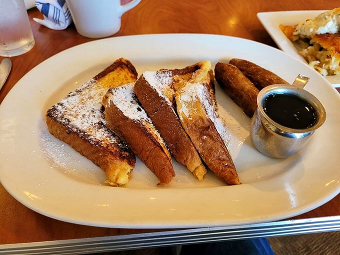 French toast that makes regular bread feel inadequate. Four golden-brown slices of morning magic that deserve their own Instagram account.