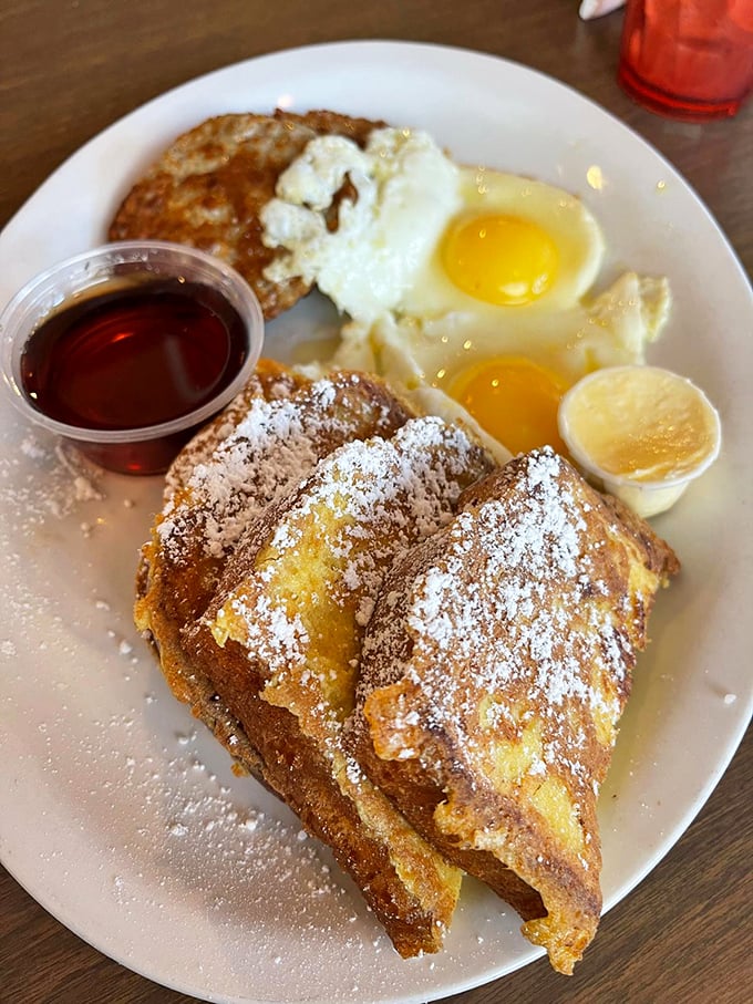 French toast that's dressed for success&mdash;golden, crispy edges giving way to custardy centers. The powdered sugar snowfall is just the beginning of this breakfast journey.