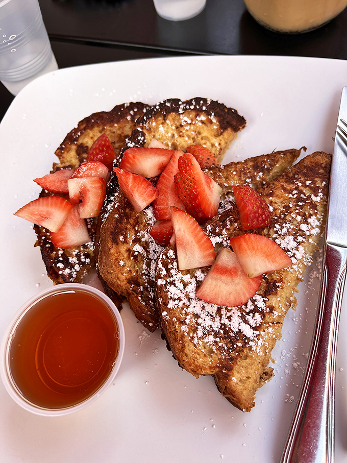 French toast that strikes the perfect balance&mdash;crispy edges, custardy center, and fresh strawberries that pop with every bite.