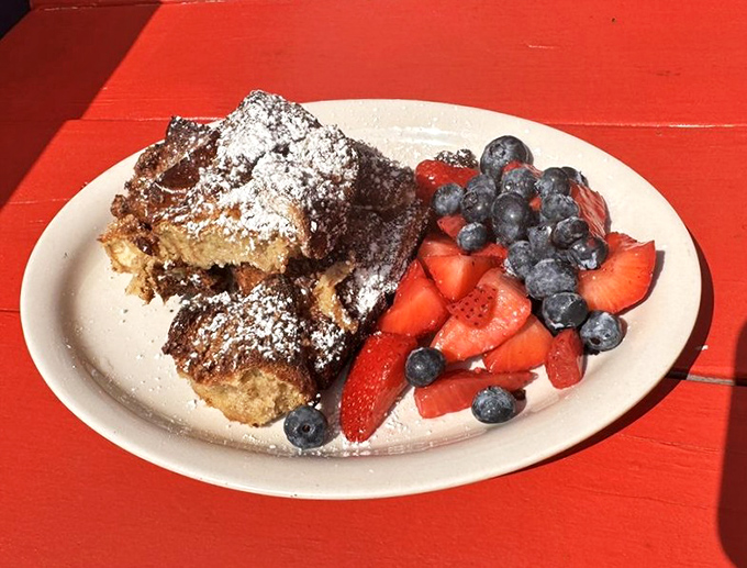 French toast that's had a proper spa treatment&mdash;powdered sugar dusting, fresh berries, and enough decadence to make Monday morning feel like Saturday.