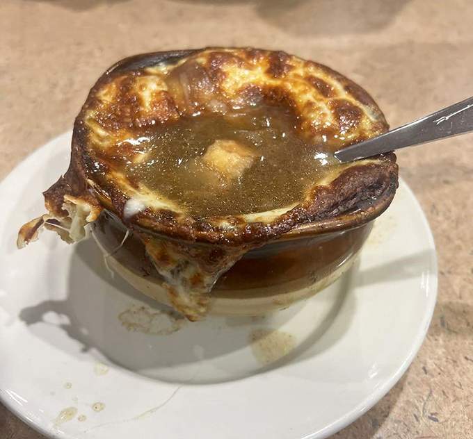 French onion soup with a cheese pull that deserves its own Instagram account &ndash; bubbling, golden, and ready to warm you from the inside out.