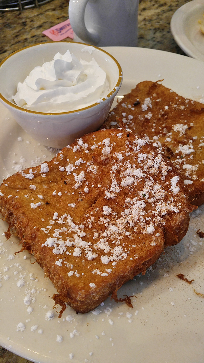 French toast that's dressed for success with a dusting of powdered sugar. Like a sweet morning hug on a plate. 