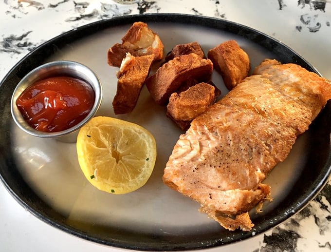 Salmon for the "I should eat healthy" crowd who still want to dine at a steakhouse. Those golden home fries aren't fooling anyone.