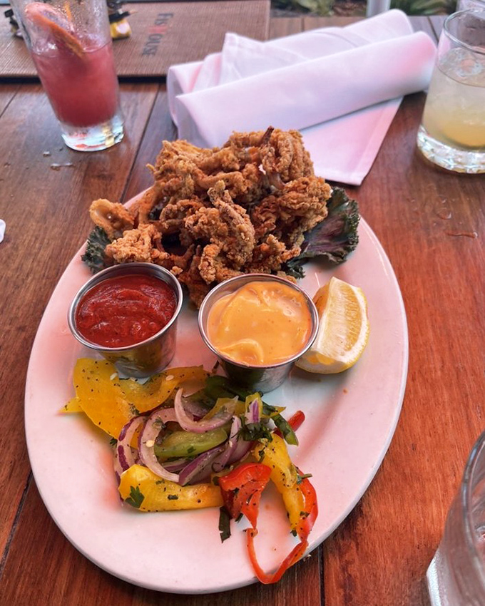 Crispy calamari rings that prove sometimes the simplest pleasures are the most satisfying – no rubber bands here, folks