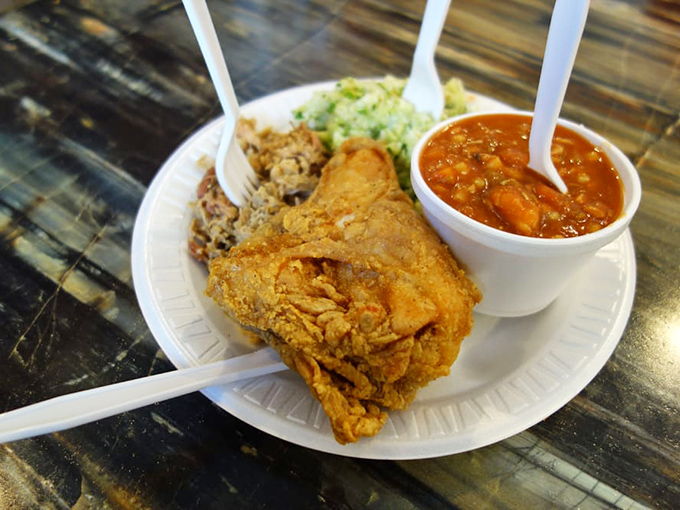 Fried chicken so perfectly golden it belongs in Fort Knox, served with Brunswick stew that grandmothers across the South would approve of.