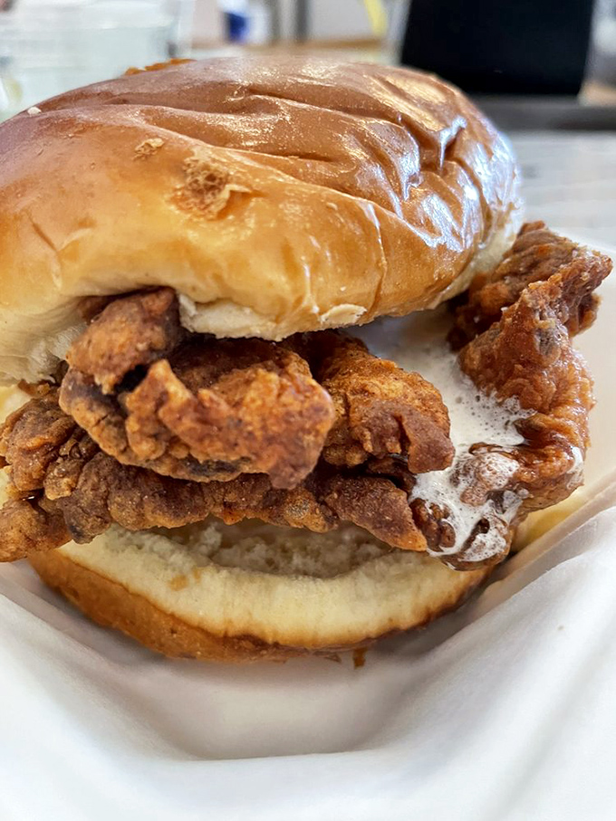 The sandwich that launched a thousand return visits&mdash;crispy fried chicken spilling out of a soft bun in a way that makes napkins absolutely necessary.