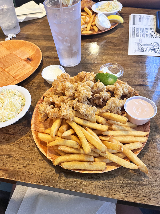 Fried clam strips and fries: the dynamic duo that's converted more seafood skeptics than any dish in history. That tartar sauce is just showing off.