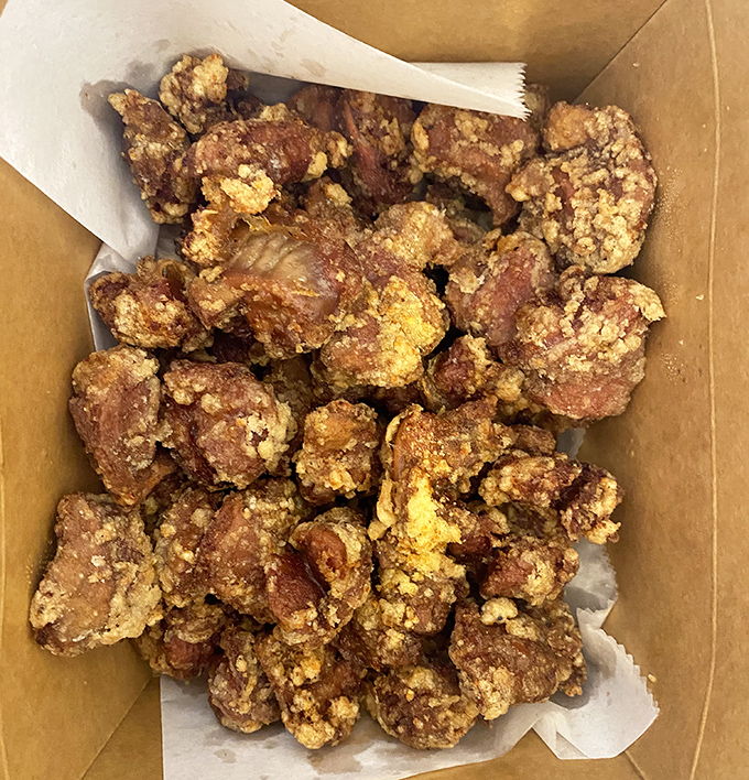Crispy karaage pieces nestled in their paper-lined box like edible treasure. The dipping sauces are the supporting actors that deserve their own Oscar.