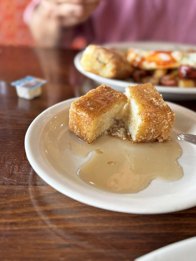 Cornbread perfection meets maple syrup in a puddle of breakfast bliss. This isn't just food; it's edible sunshine that makes Monday mornings bearable.