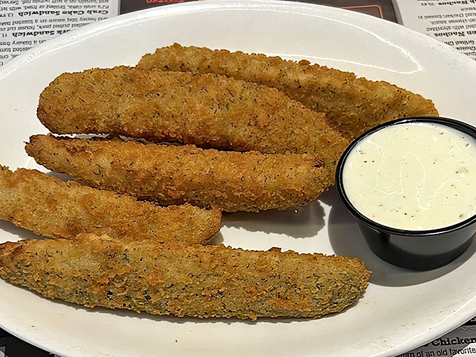 These fried pickle spears aren't just side dishes &ndash; they're crispy, tangy declarations that vegetables can be indulgences too.