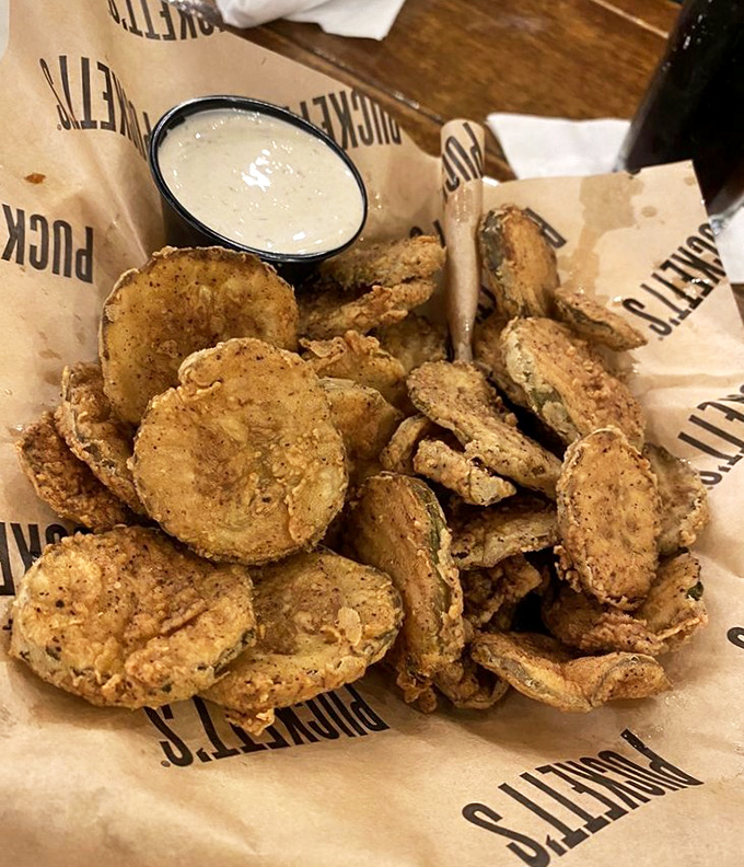 These aren't just fried pickles &ndash; they're crunchy little discs of happiness, waiting to take a dip in that creamy sauce of dreams.