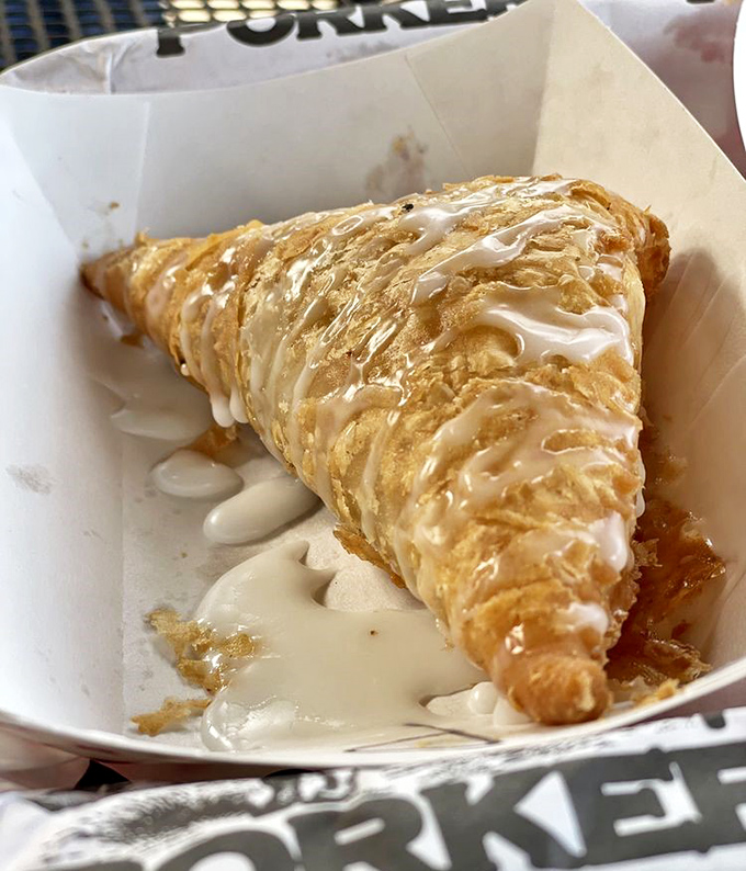This isn't just dessert, it's edible nostalgia&mdash;a golden-fried pie drizzled with sweet glaze that would make your grandmother both proud and jealous.