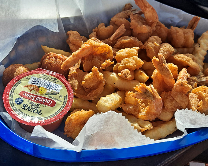 Seafood that doesn't need a fancy introduction. These golden-fried shrimp huddle together like old friends, waiting to be dipped in cocktail sauce.