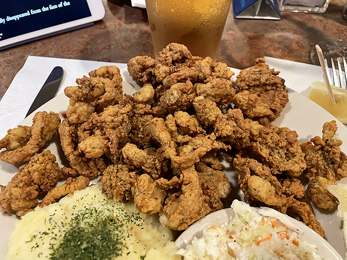 Golden mountain of fried clam goodness—crispy outside, tender within—the kind of dish that makes you contemplate moving closer to the restaurant.
