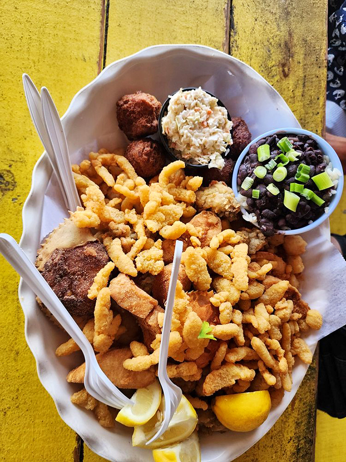 A seafood platter that answers the eternal question: "Why choose one fried delicacy when you can have them all?" The lemon wedges are just for show.