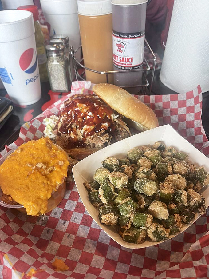 Sweet potato casserole, BBQ sandwich, and fried okra&mdash;the holy trinity of Southern comfort. Diet books weep silently in the distance.