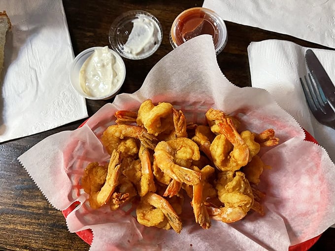These golden-battered shrimp aren't just fried—they're transformed into crunchy vessels of oceanic delight. The dipping sauces are merely supporting actors.