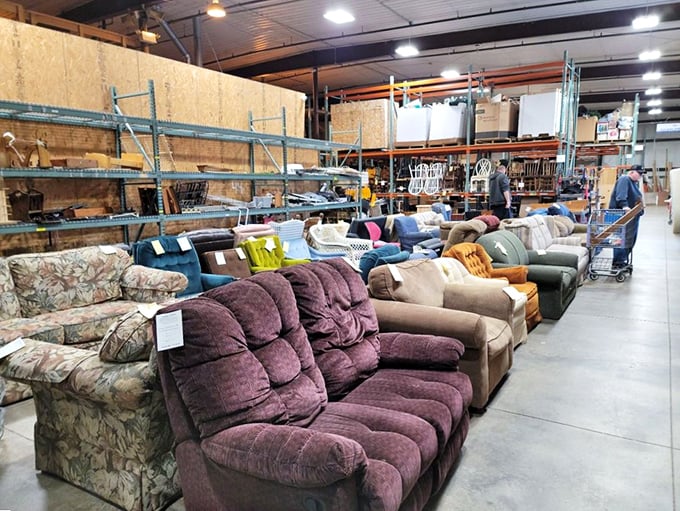 Couch potato paradise where recliners and sofas await their next Netflix binge partner. That purple velvet number is practically begging for someone to fall asleep watching documentaries.