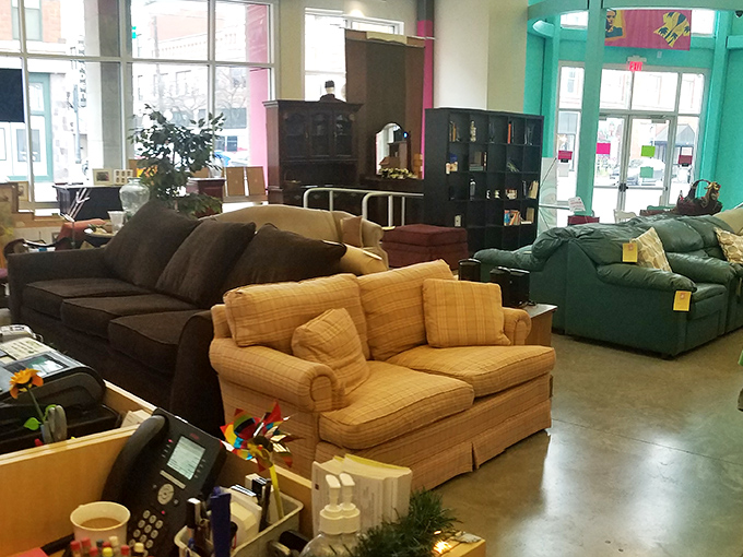 Furniture that tells stories. That green couch has probably hosted everything from heartfelt conversations to someone's impromptu nap after Thanksgiving dinner.
