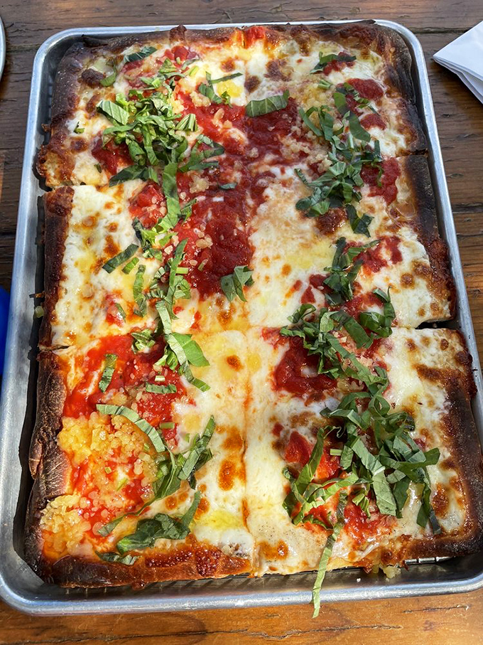 The Grandma pie brings rectangular rebellion to a round pizza world. Fresh basil adds that "kiss from an Italian grandmother" finish.