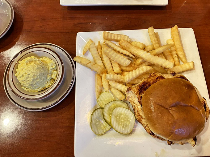 A sandwich that doesn't need Instagram filters, served with fries so perfectly golden they deserve their own retirement account.