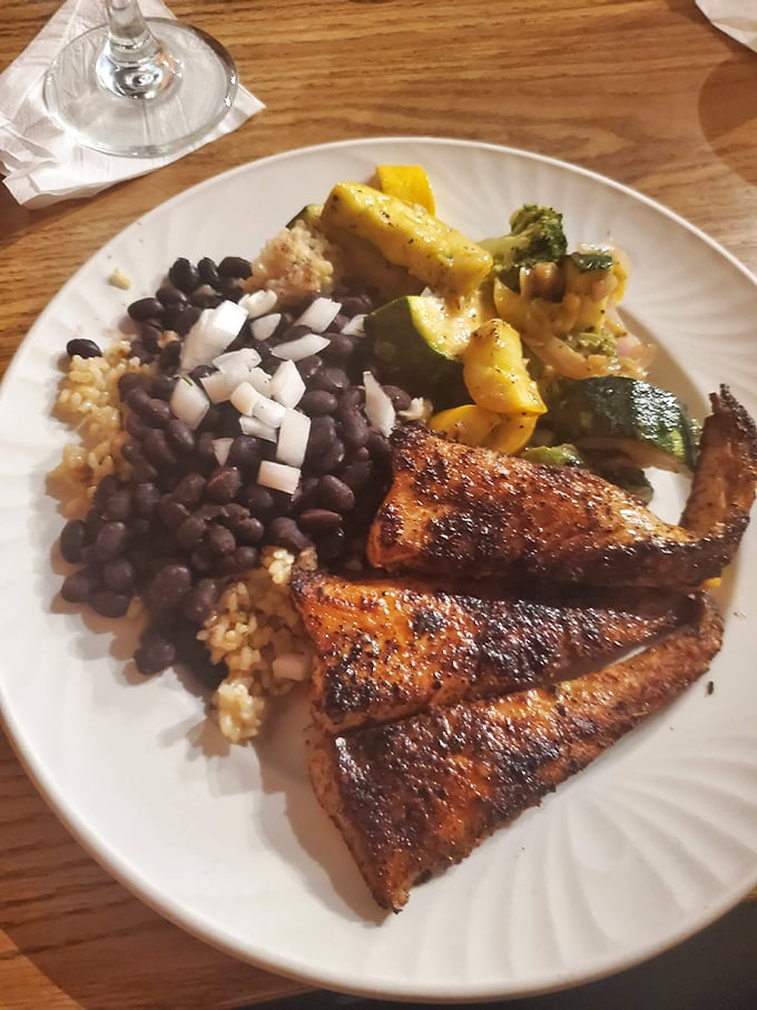Blackened fish that would make Paul Prudhomme proud, served with black beans and rice that could start a religion in certain circles.