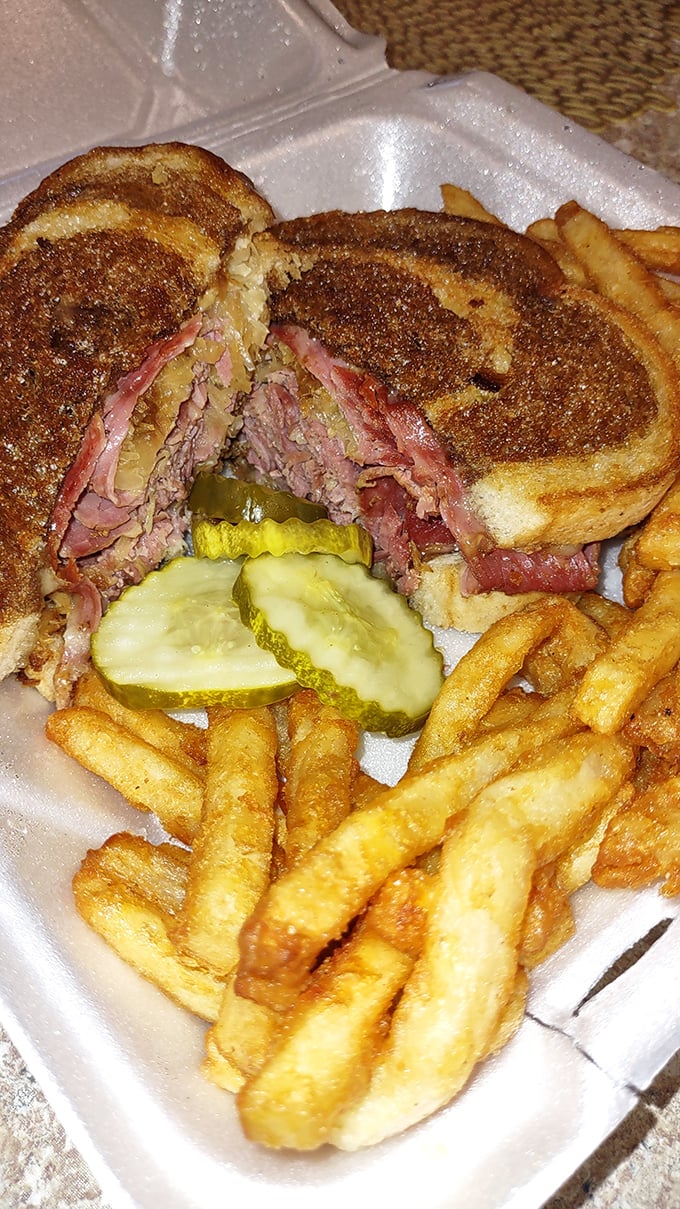 The Reuben&mdash;that perfect marriage of corned beef, sauerkraut, and grilled rye&mdash;sits proudly alongside crispy fries like it knows exactly how good it is.