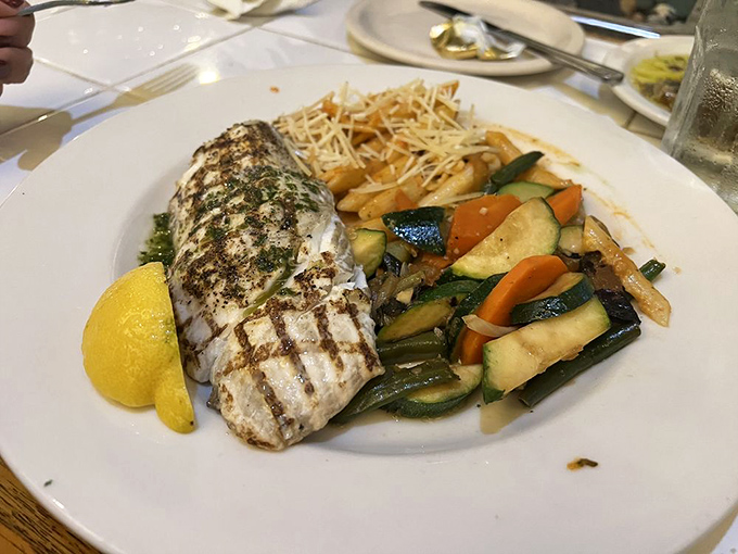 Perfectly grilled halibut with seasonal vegetables proves that sometimes the simplest preparations let truly fresh fish shine brightest.
