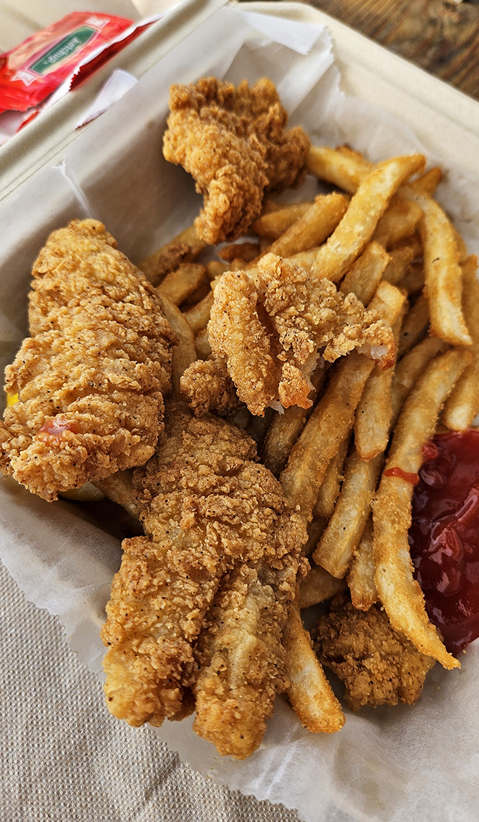 Golden-fried fish nuggets that crunch like childhood memories. Proof that sometimes the most unassuming dishes deliver the most satisfaction.