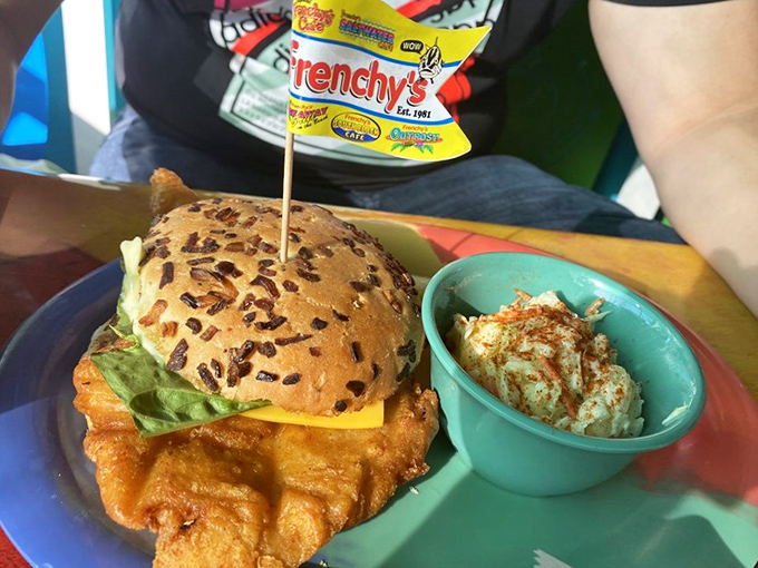 The sandwich that launched a thousand return trips. Golden-fried grouper spilling over its bun borders with a side of coleslaw for good measure.