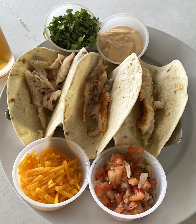 Fish tacos done right&mdash;simple, fresh, and accompanied by all the fixings. The perfect handheld vacation for your taste buds.