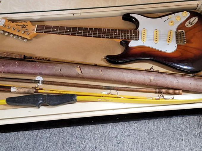 Rock and roll archaeology! This vintage electric guitar might have once serenaded sock-hopping teenagers or accompanied a garage band's dreams of stardom.