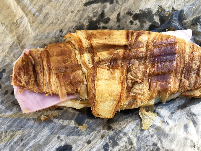 The humble ham and cheese croissant, elevated to art form. Those buttery layers didn't happen by accident &ndash; they're the result of pastry science and French magic.