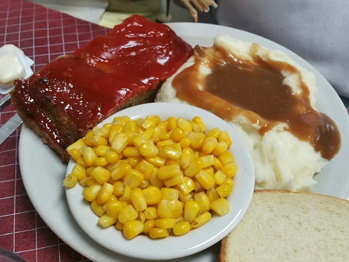 Comfort food doesn't get more nostalgic than this&mdash;meatloaf glazed to perfection alongside mashed potatoes drowning happily in gravy.