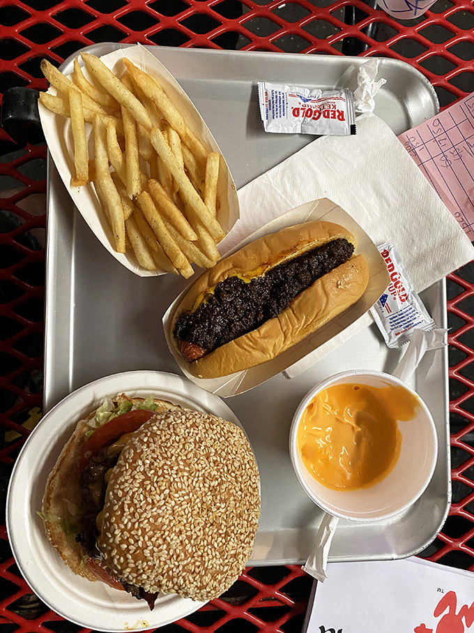 A feast fit for road-trip royalty: golden fries, ice-cold drinks, and burgers that make fast food chains weep with inadequacy. 