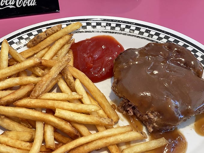 Hamburger steak swimming in gravy&mdash;comfort food that doesn't need a passport, a backstory, or a social media presence to make you feel instantly at home.