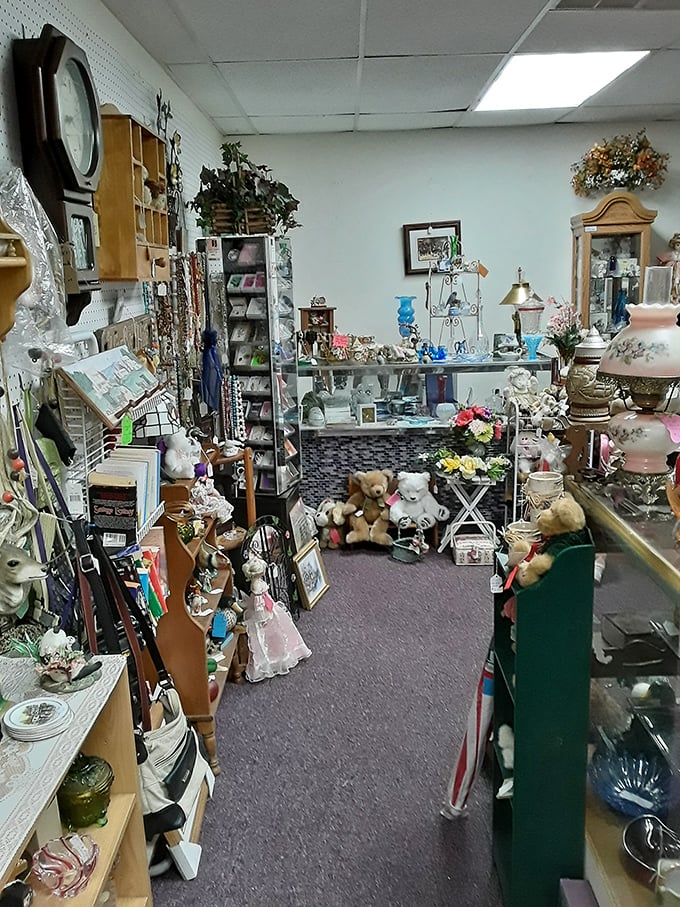 Teddy bears stand guard over delicate glassware and vintage lamps, creating a whimsical vignette that's equal parts childhood nostalgia and sophisticated collecting.