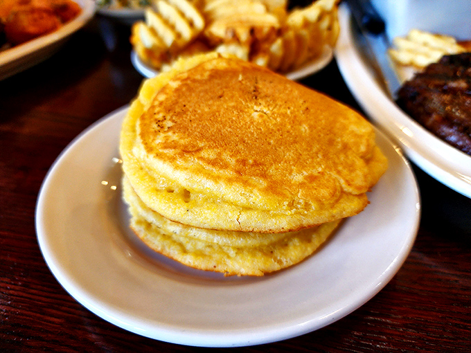 Golden cornbread cakes that would make your grandmother simultaneously proud and jealous of their perfect texture.