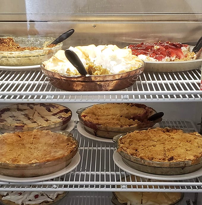 The pie case of dreams, where calories don't count and every slice tells a delicious story.