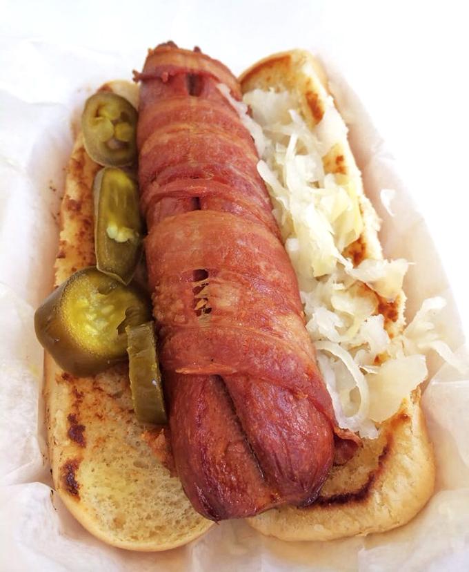 A hot dog that got all dressed up for its Key West vacation &ndash; complete with sauerkraut accessories and a tan that would make George Hamilton jealous.