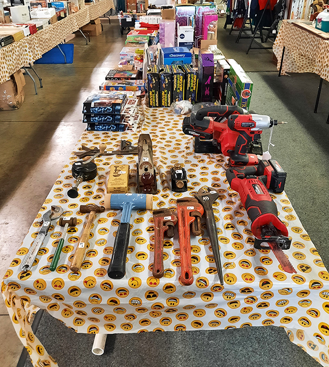 Tools that tell stories! This emoji-patterned tablecloth showcases everything from vintage wrenches to modern power drills&mdash;a handyperson's dream buffet.
