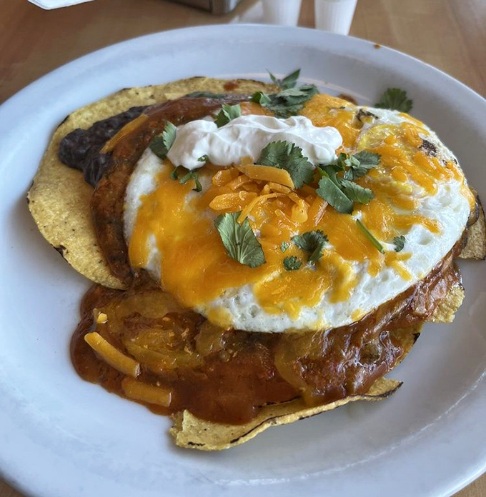 Breakfast architecture at its finest&mdash;crispy tortillas, perfectly runny eggs, and a sauce that could wake you up faster than three espressos.